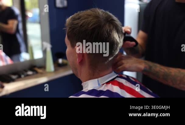 Barber making stylish male haircut using clipper in barbershop 4k movie ...
