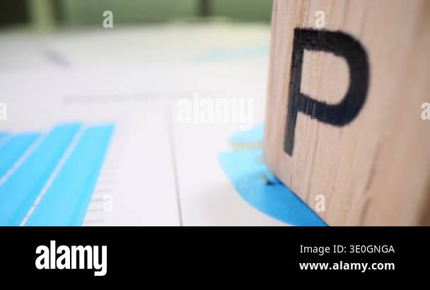 Neatly arranged wooden cubes form word PROFIT in capital letters put on ...