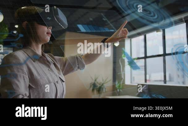 Woman in VR headset pointing, swiping holo bar charts, pinching to ...