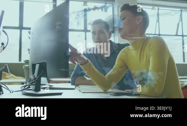 Woman pointing at monitor, guiding man, initiating tech overlays on ...
