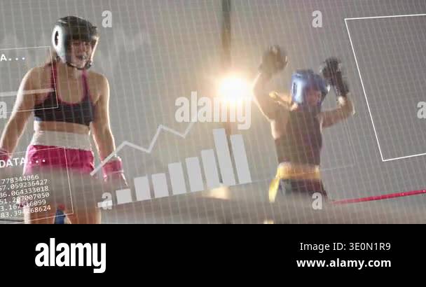 Woman in blue helmet cheering boxing win once coach lifting her arm ...