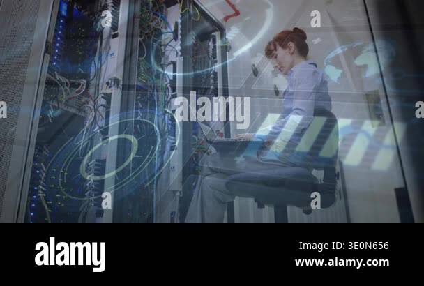 Woman IT technician touching laptop typing, checking server LEDs while ...