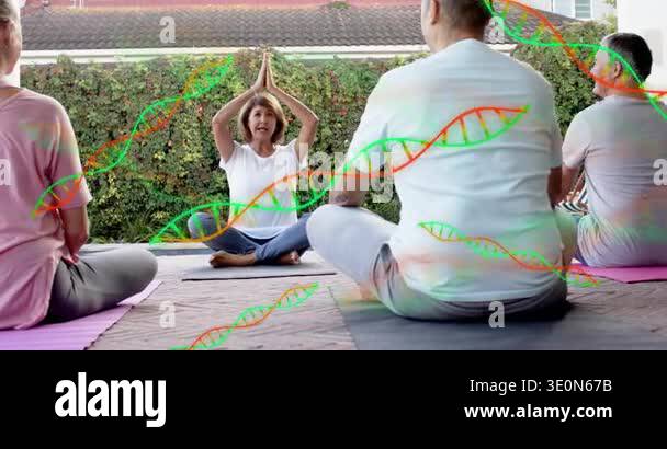 Lead teacher raising arms to start yoga breathing, class mirroring on ...
