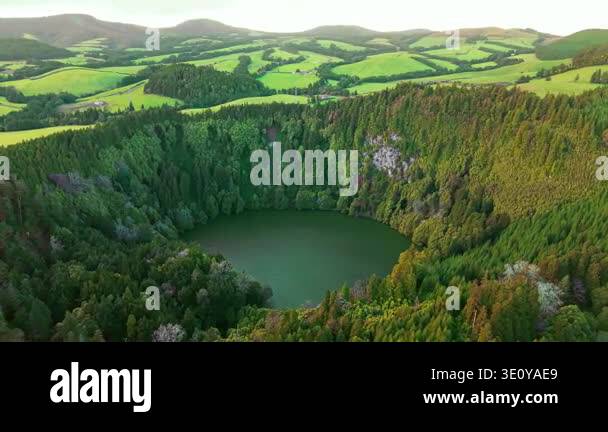 Aerial view of Lagoa do Congro, a hidden volcanic lake surrounded by ...