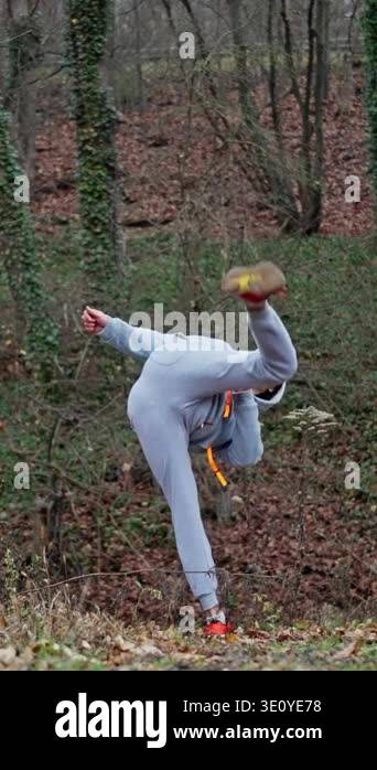 White Man Training Explosive Jump Kick. Airborne Turn And Focused ...