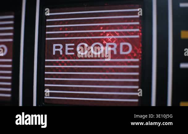 Close-up of a flashing red record indicator light on vintage audio ...