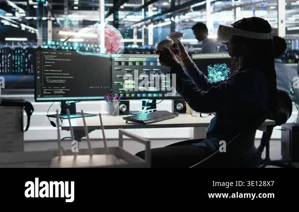Software developer in data center uses virtual reality simulation to ...