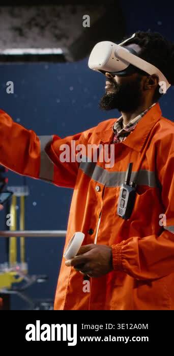 Vertical Video Engineers with VR glasses on offshore oil platform use ...
