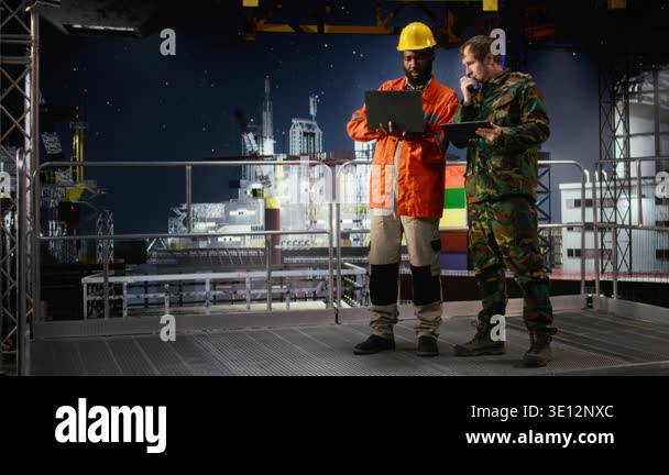 Professional military operative communicates via radio on offshore ...