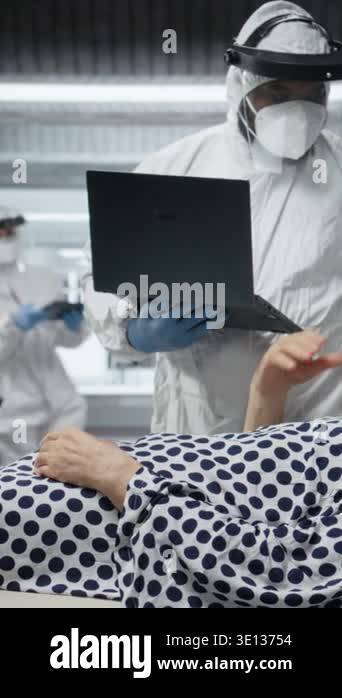 Vertical Video Doctor in biohazard lab conducts medical trial on a ...
