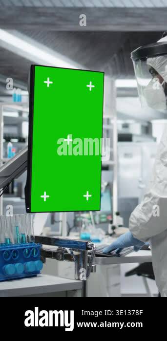 Vertical Video Vertical chroma key screen next to scientist in a ...