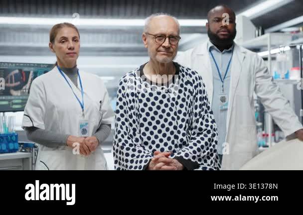 Portrait of diverse researchers and old man posing in modern laboratory ...