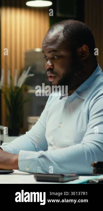 Vertical Video Angry african american guy getting mad and failing to ...