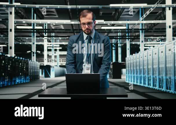 Data center technician using laptop and augmented reality to install ...