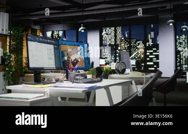 Modern architecture workspace featuring dual monitors with 3D rendering ...