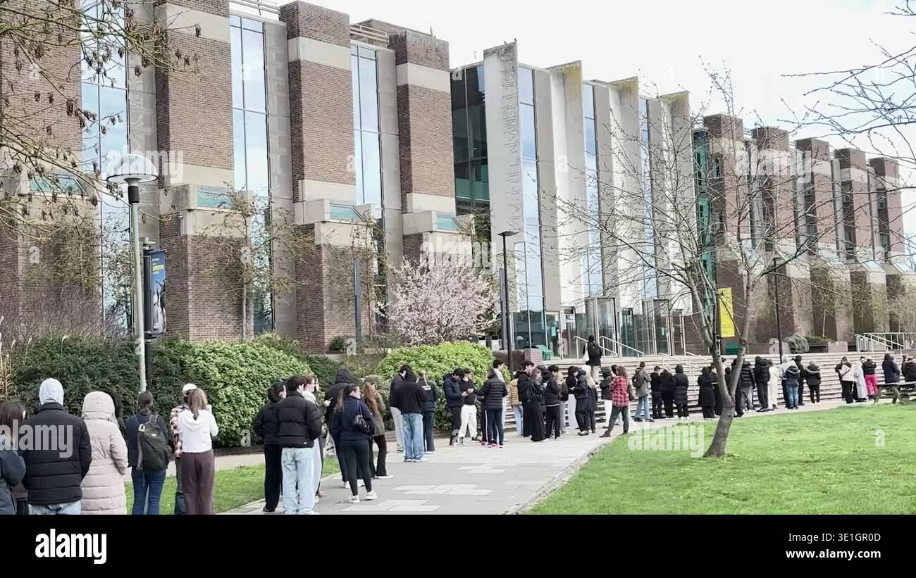 Students queue for antibiotics at the University of Kent as two people ...
