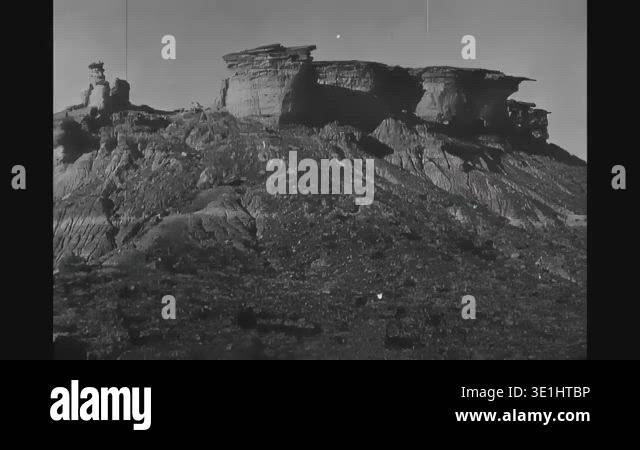 ARIZONA - 1916 - A desert landscape featuring mesas and buttes. A cross ...