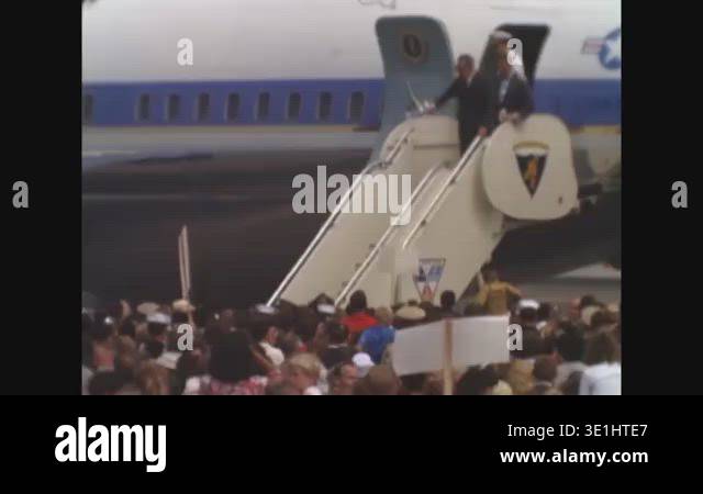 POINT MUGU - 1963 - President Kennedy waves to the crowd as he climbs ...