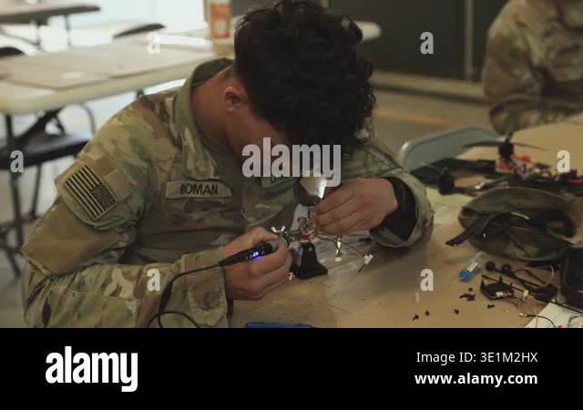 GERMANY - 8.6.2025 - US Army soldiers use soldering tools to assemble ...