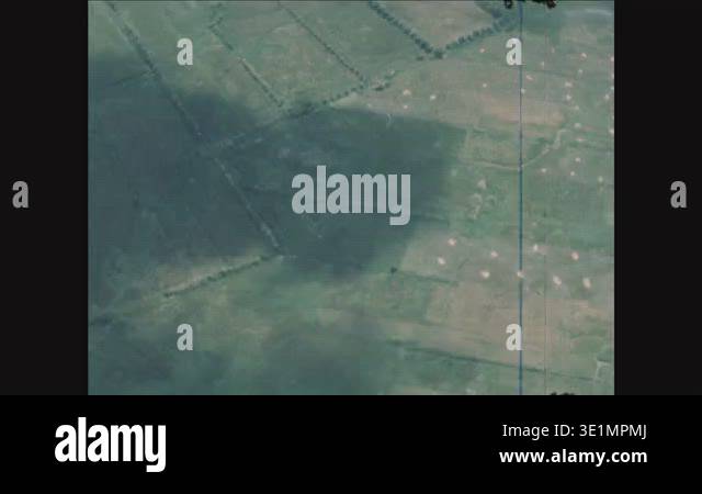 VIETNAM - 1970 - Aerial view of helicopters flying low above lush ...