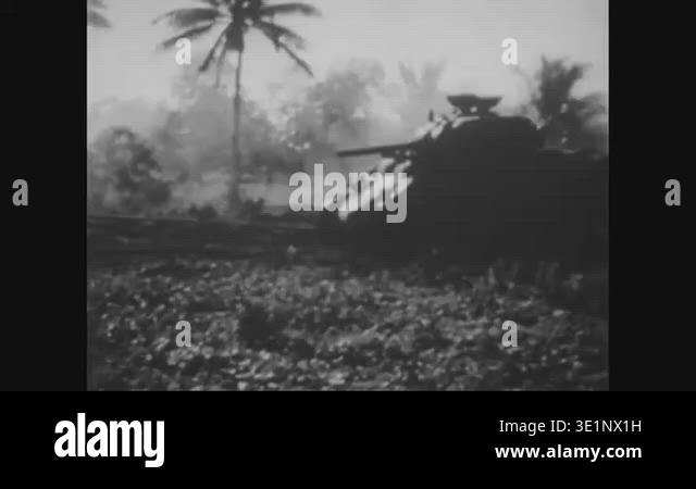 GUAM - 1945 - Tanks and troops of the 3rd Marine division move into an ...