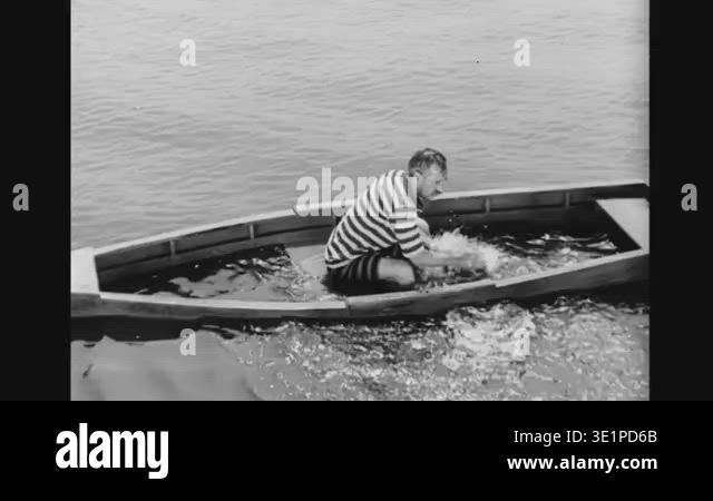 USA - 1930 - In this comedy, a man in motorboat rides by to save a man ...