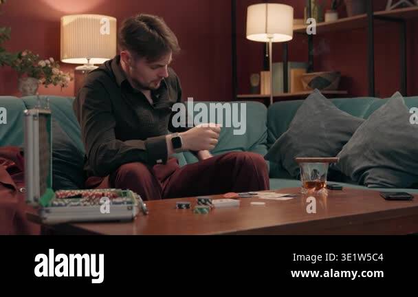 Drunk depressed Caucasian male gambler open empty wallet losing poker ...