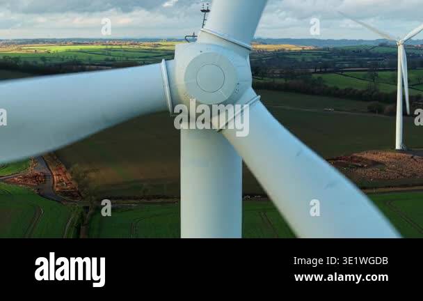 Aerial drone view of wind turbines at Kelmarsh Wind Farm, captured in ...
