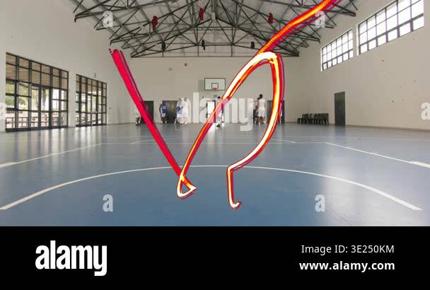 Neon trails appearing, looping around nine-man team stepping forward ...