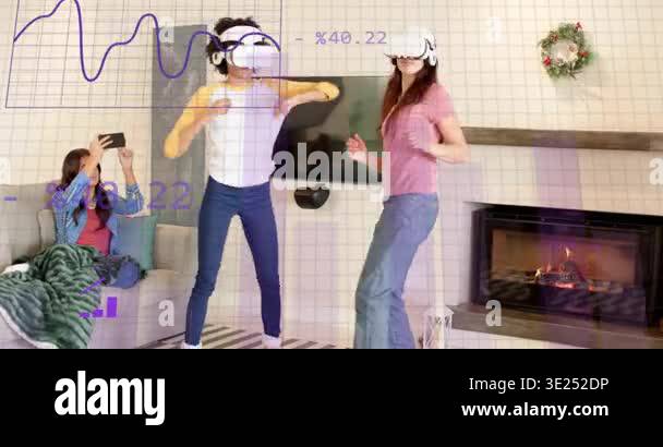 VR activating, two women in headsets moving and dancing, friend filming ...