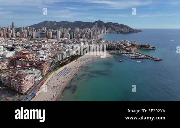 Drone aerial view of Benidorm skyline with sandy beach marina and ...
