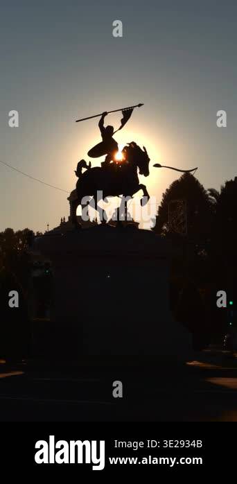 Sunset Silhouette Equestrian Statue Backlit, Car Passing Roundabout ...