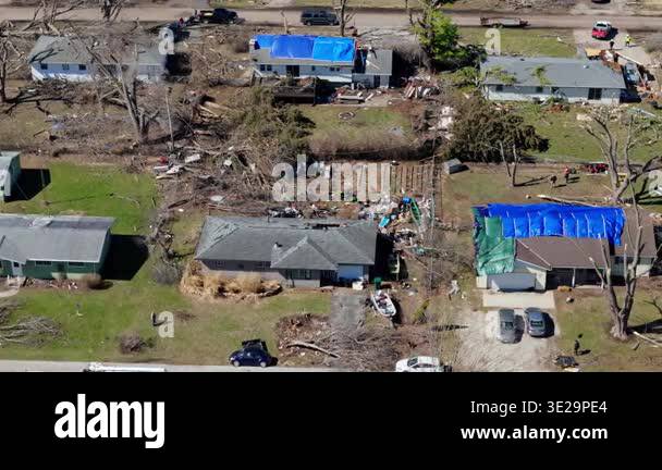 Drone view of residential neighborhood destruction after a tornado with ...