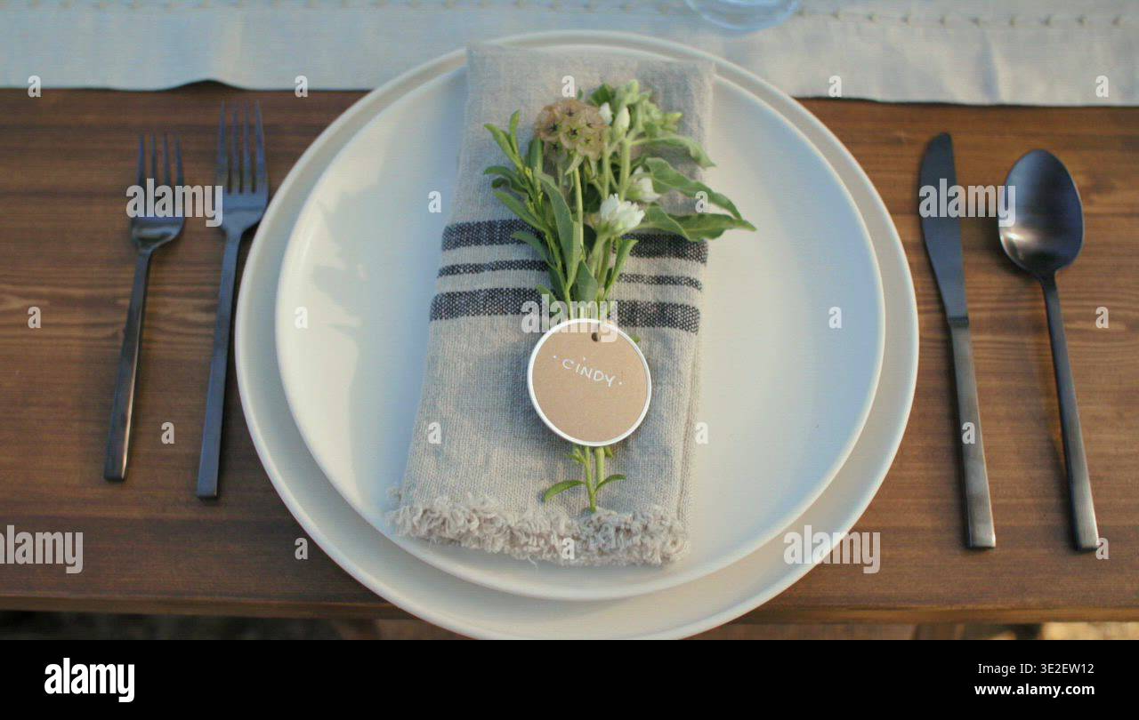 Empty place setting and name tag at an outdoor dinner table Stock Video ...