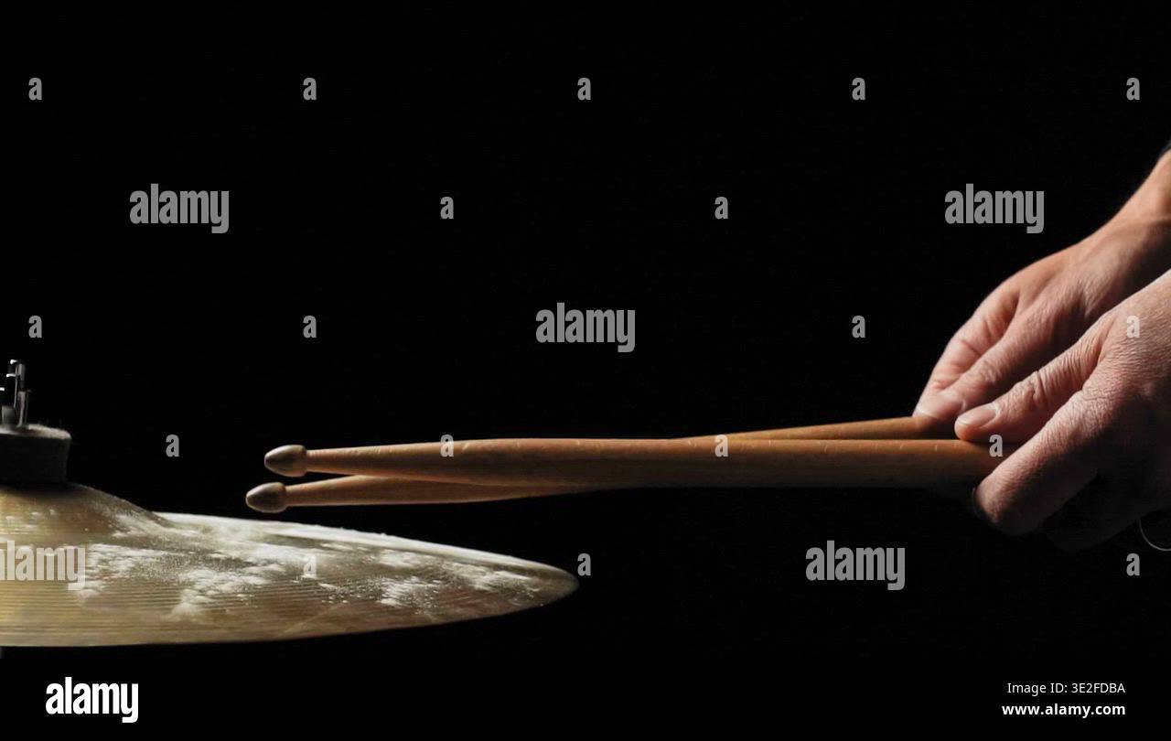 Drumsticks hitting a cymbal in slow motion Stock Video Footage - Alamy