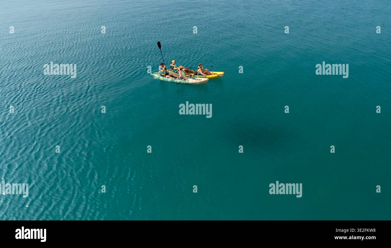 Exploring Greece seashore on a canoe Stock Video Footage - Alamy
