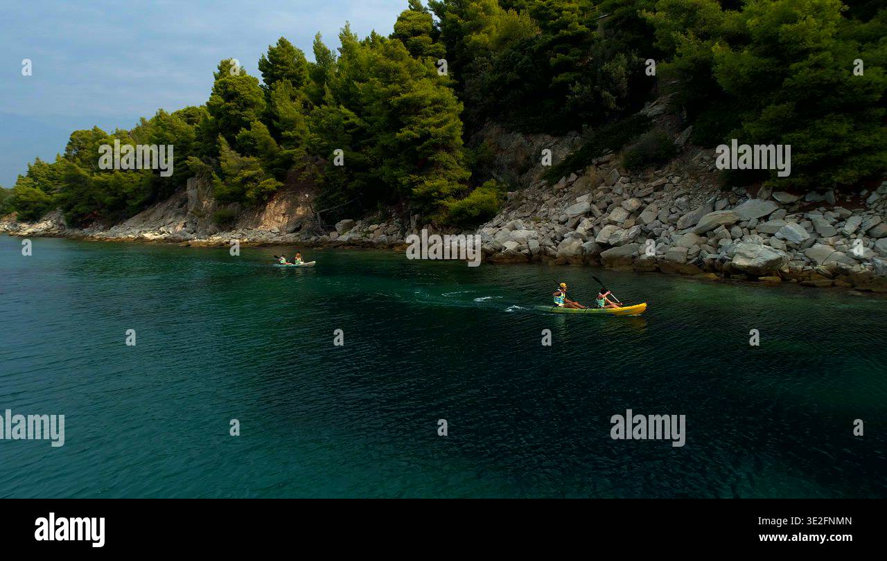 Exploring Greece seashore on a canoe Stock Video Footage - Alamy