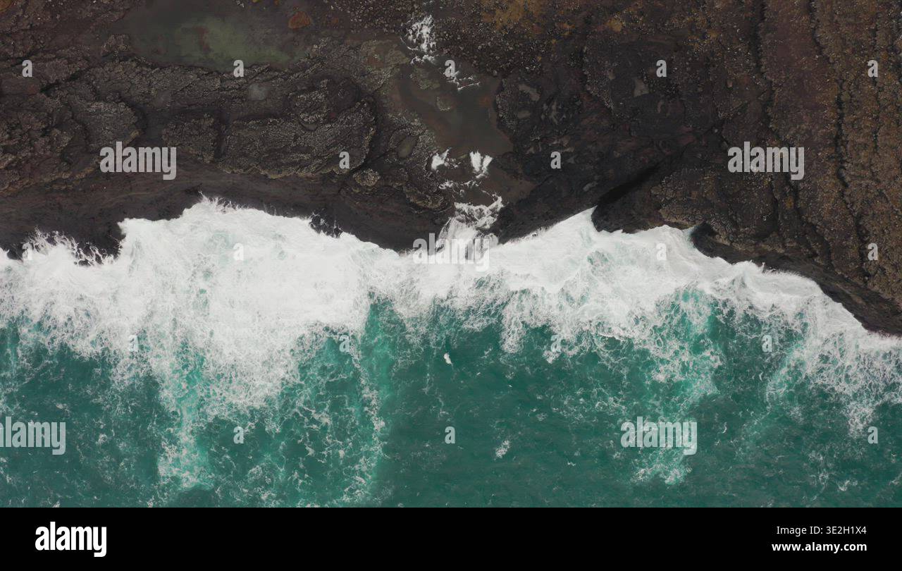 Top view of waterfall flow into sea waves Stock Video Footage - Alamy