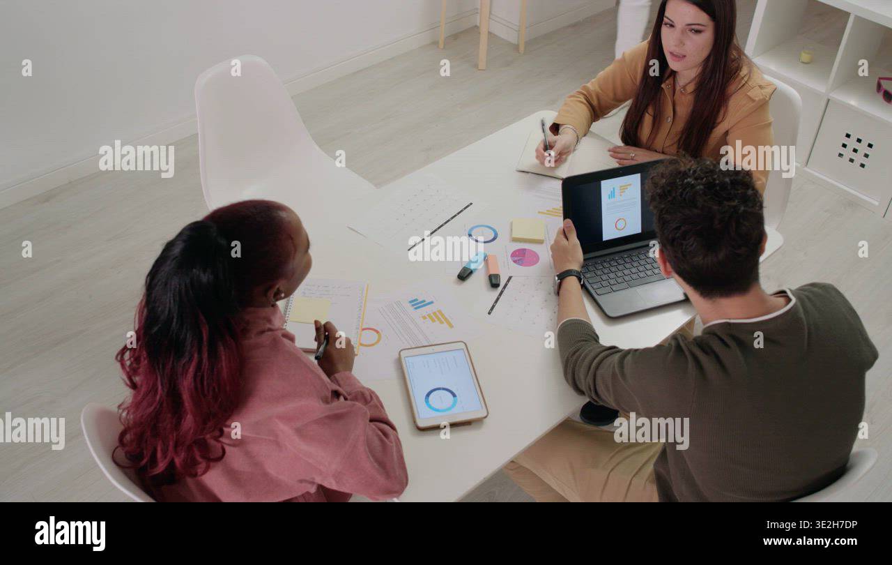 Diverse design team discussing schemes in creative workplace Stock ...