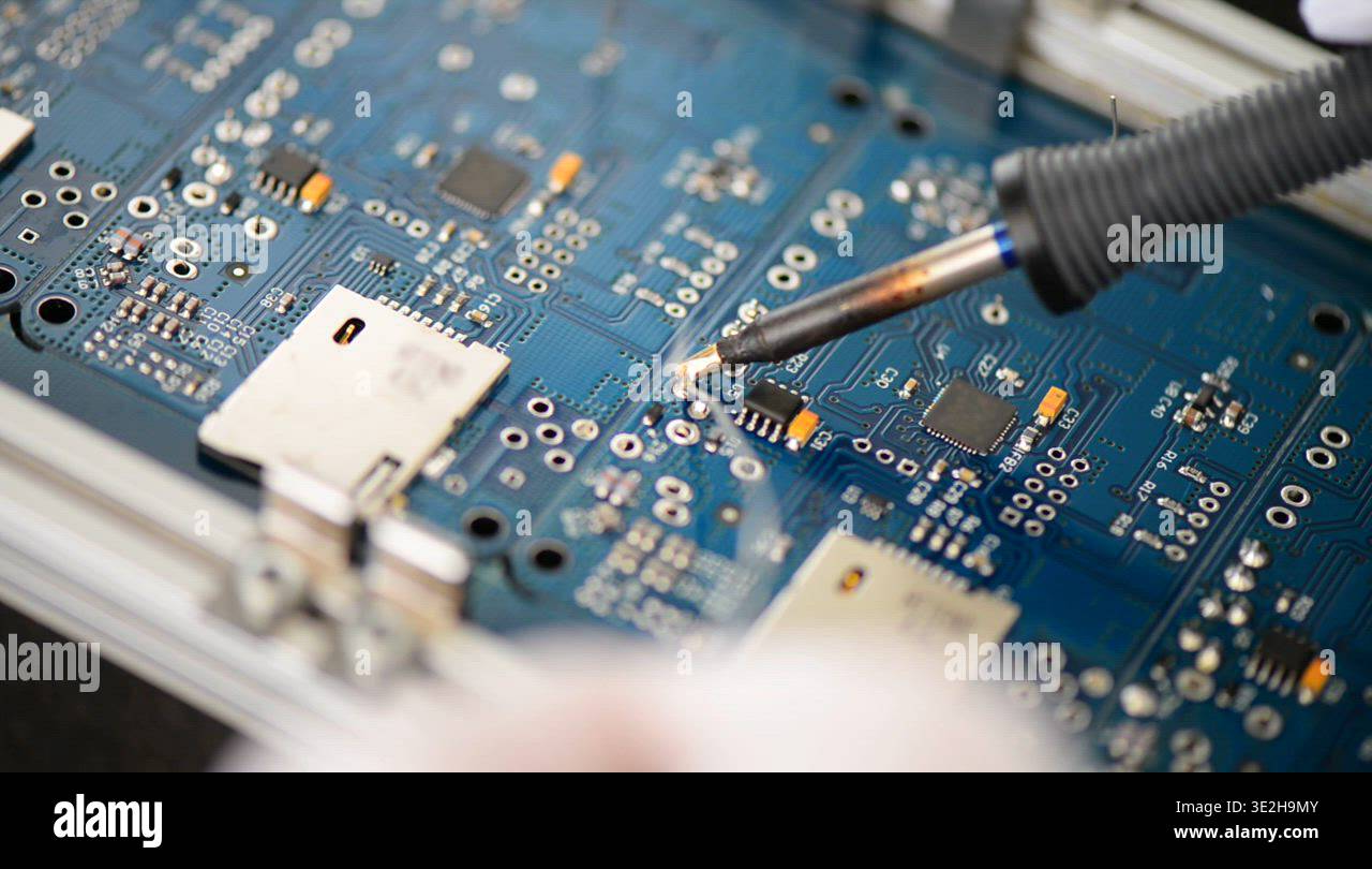 Worker soldering circuit board Stock Video Footage - Alamy