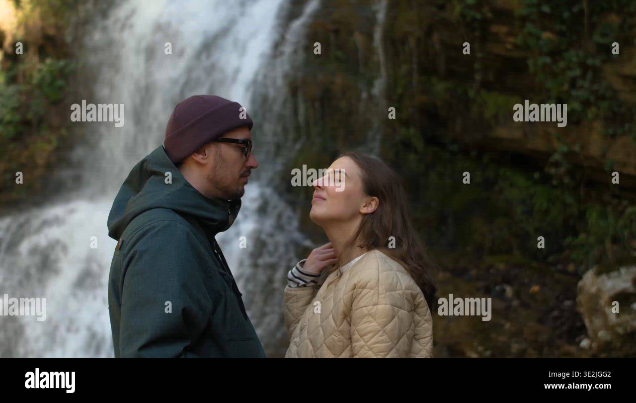 man and woman kiss at waterfall Stock Video Footage - Alamy