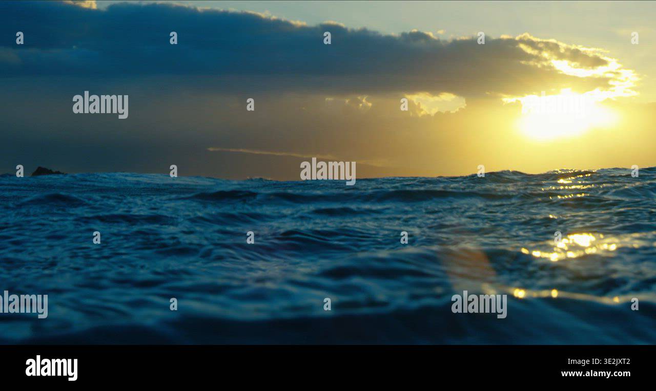 Reflective ocean water surface at sunset Stock Video Footage - Alamy