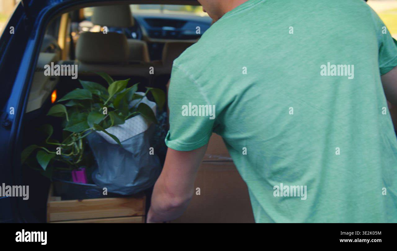 Man Taking Things Out of Trunk Stock Video Footage - Alamy