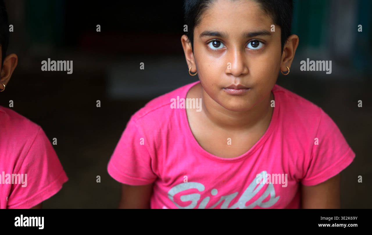 Twin Indian girl sit outside house together Stock Video Footage - Alamy