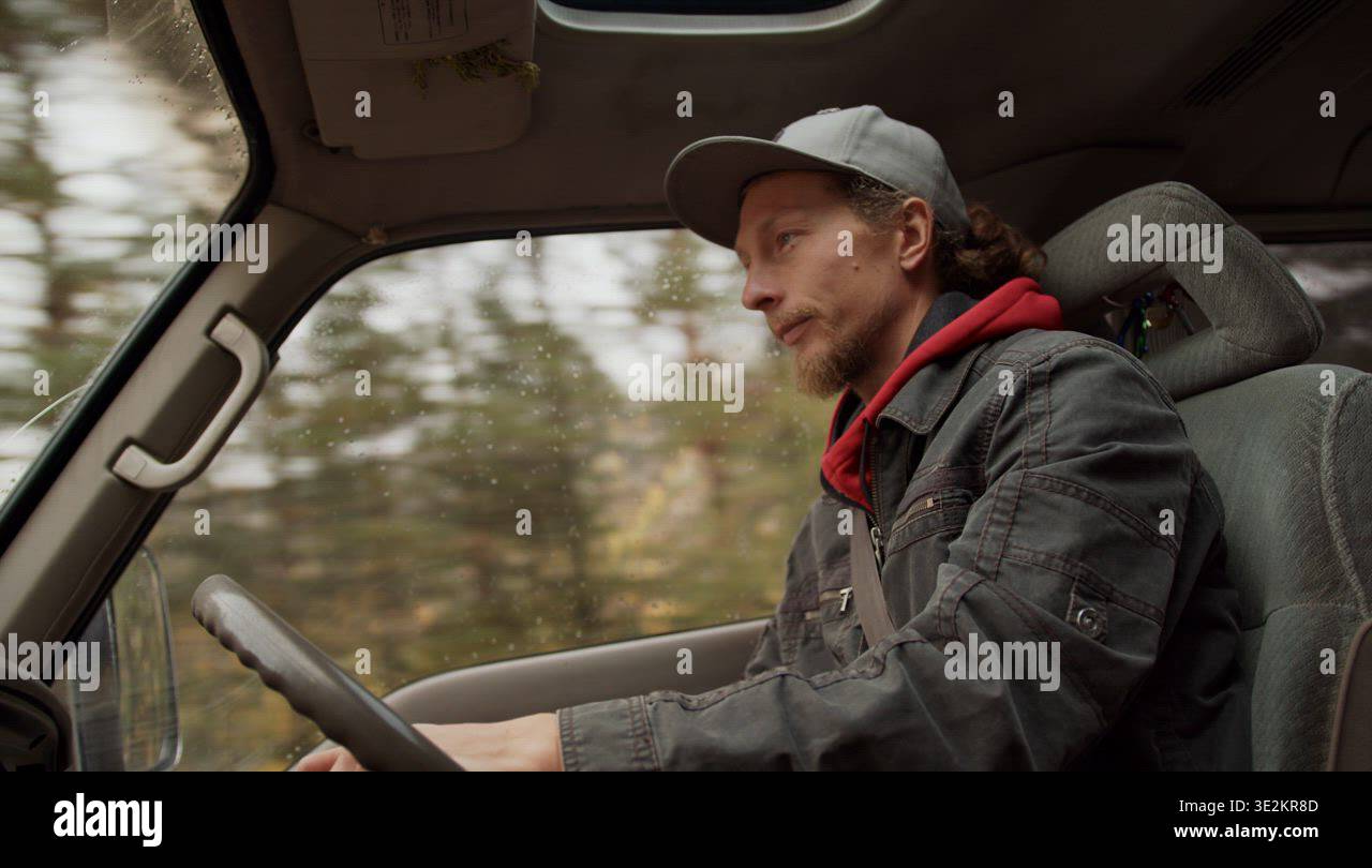 Man driving vehicle in autumn nature Stock Video Footage - Alamy