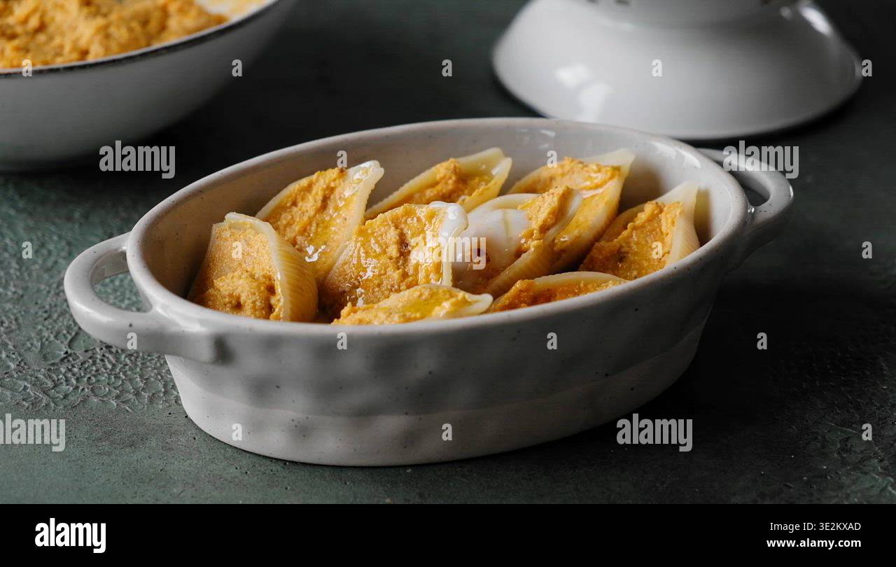 Pouring bechamel on pasta filled with creamy pumpkin Stock Video ...