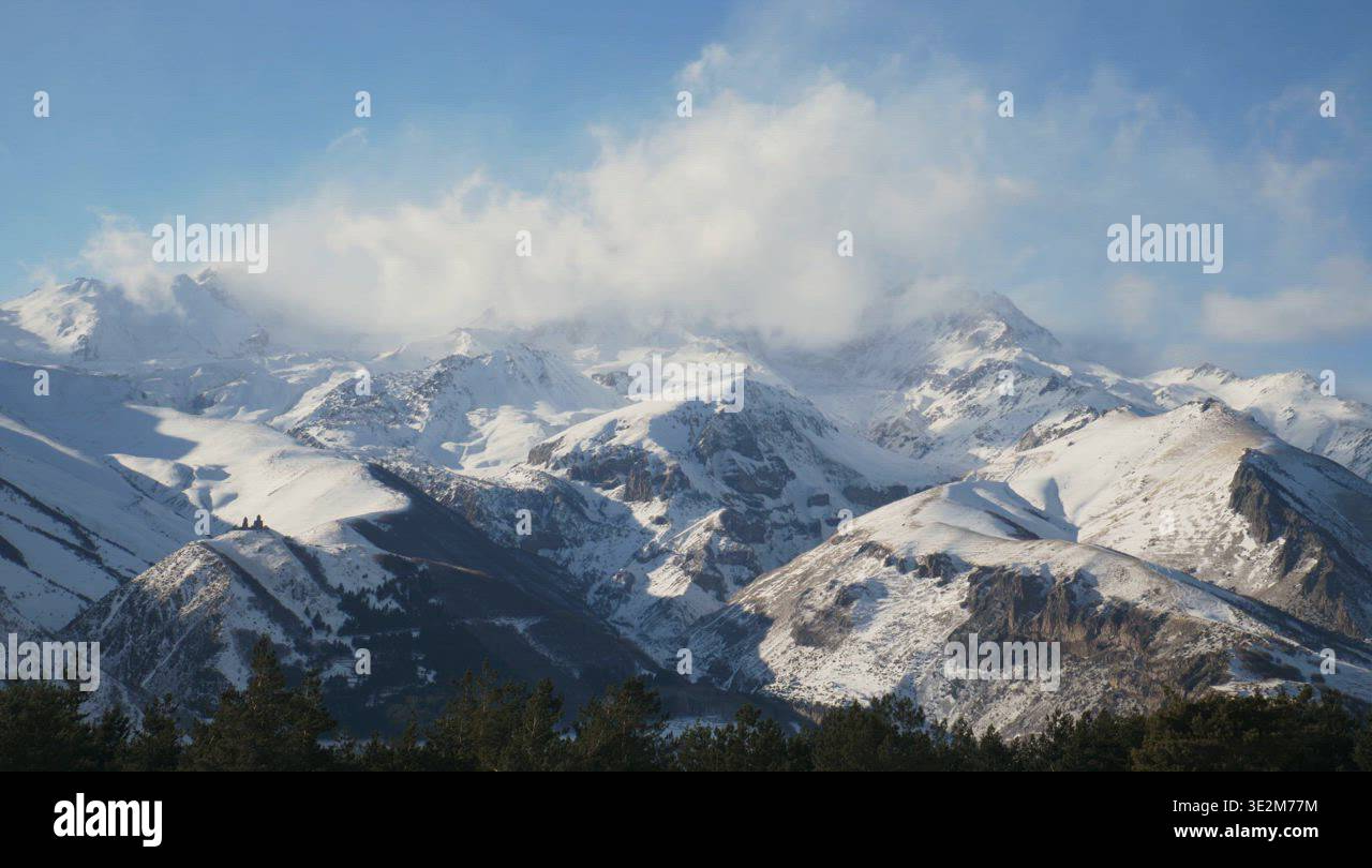 Clouds over the mountains winter time-lapse Stock Video Footage - Alamy