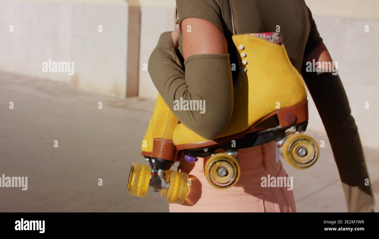 Anonymous woman carrying roller skates on street Stock Video Footage ...