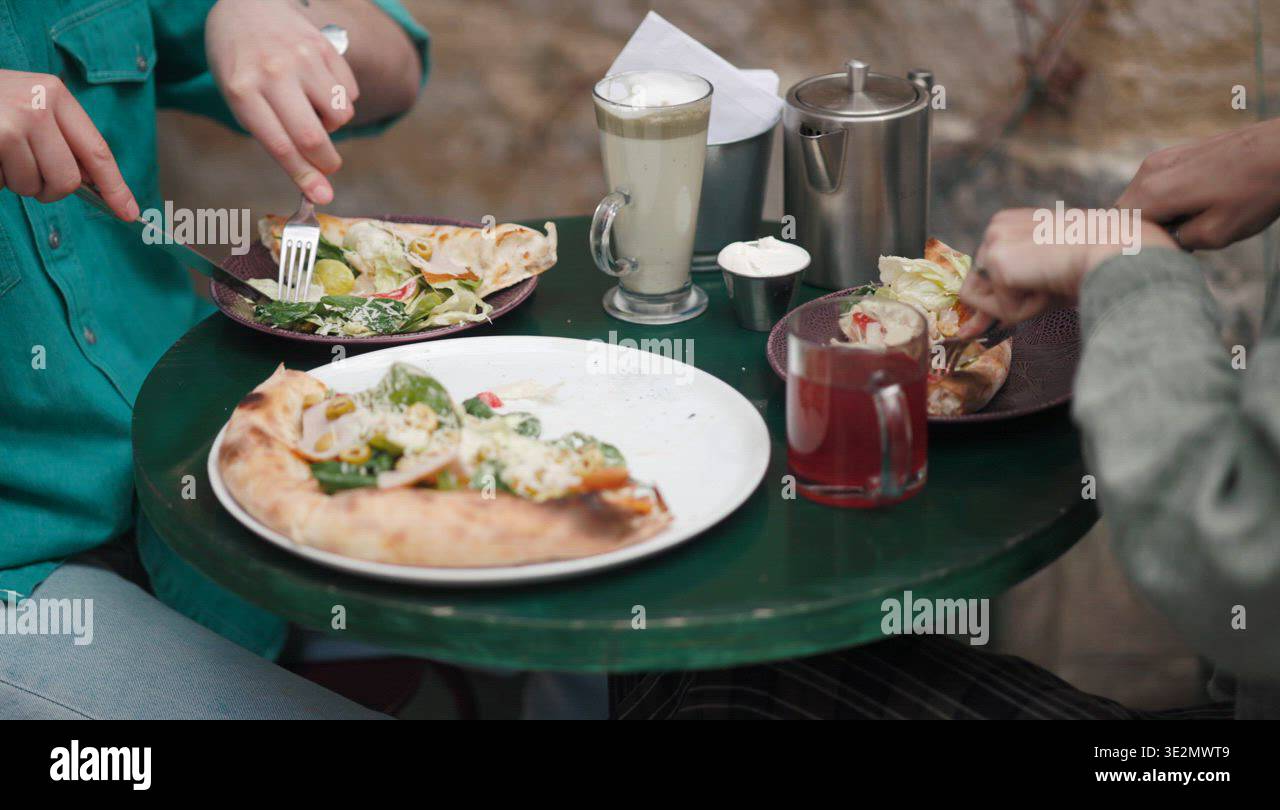 Incognito clients eating pizza during lunch in bistro Stock Video ...