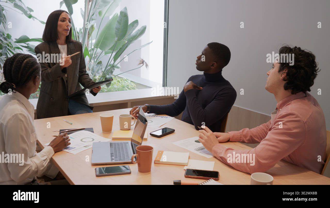 Female boss speaking to employees during briefing Stock Video Footage ...